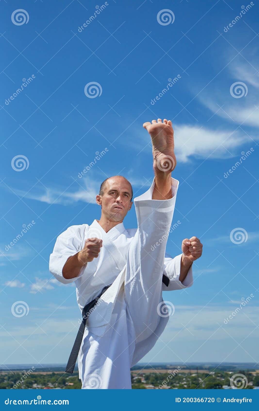 Active Athlete Kicks Kick Against Blue Sky Stock Photo - Image of ...