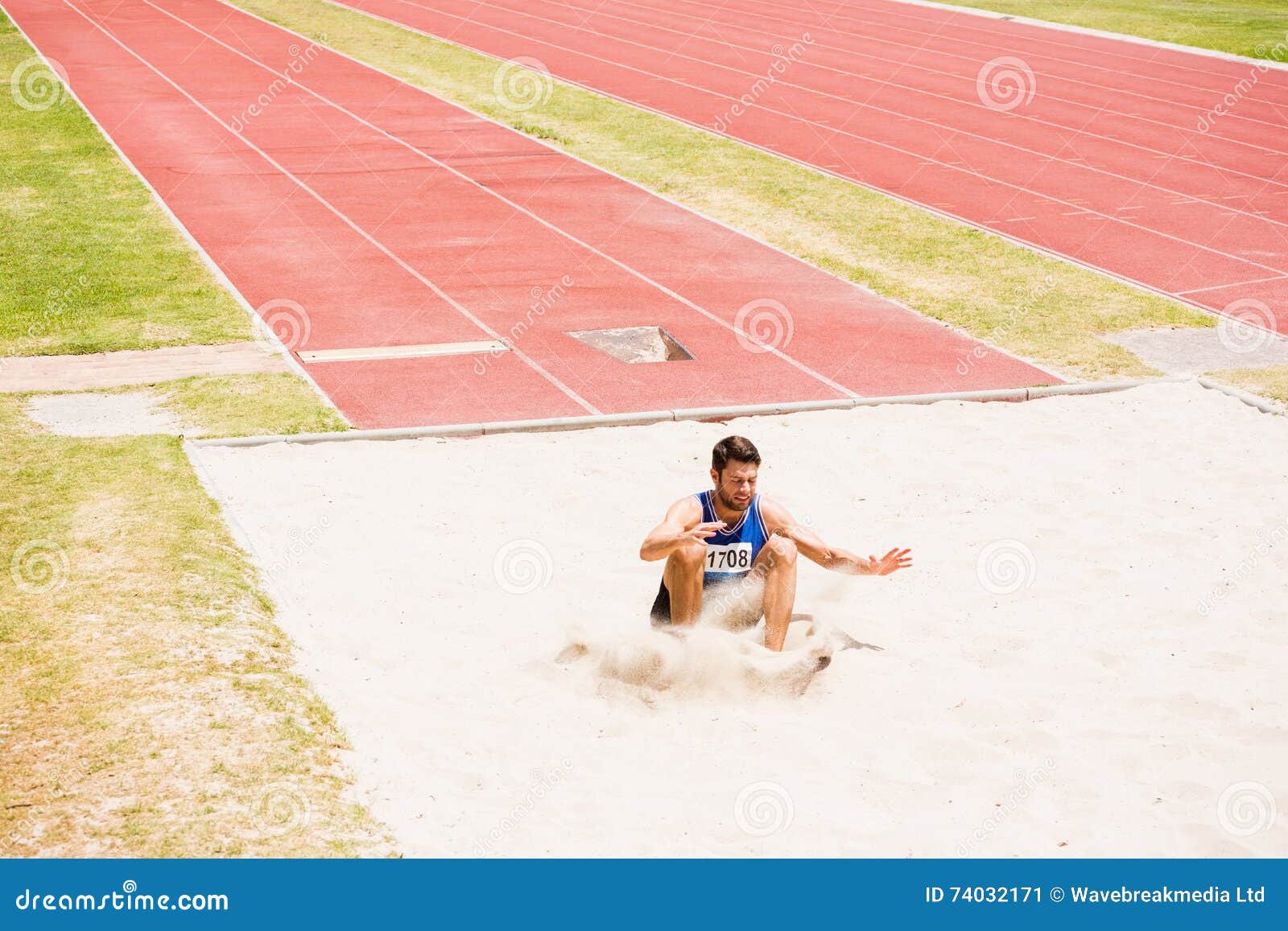 Athlete landing on sandpit stock image. Image of athlete - 74032171