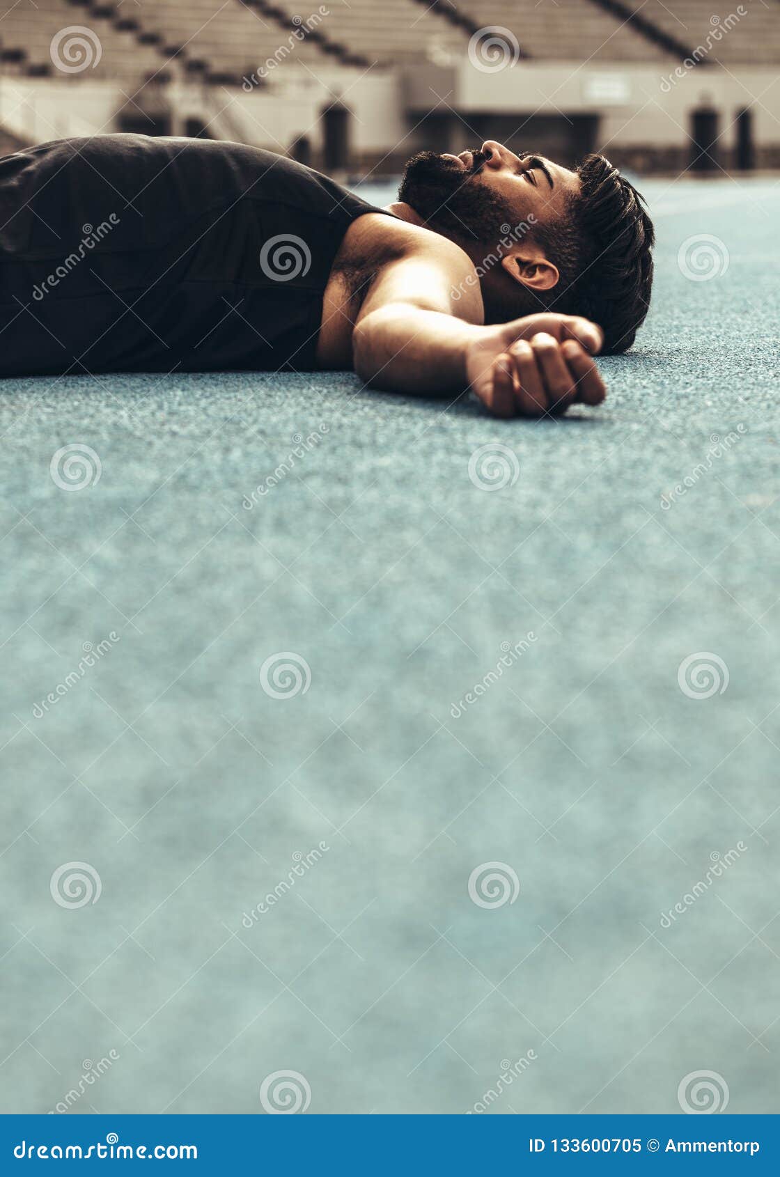 Sprinter Relaxing on the Running Track after the Race Stock Image ...