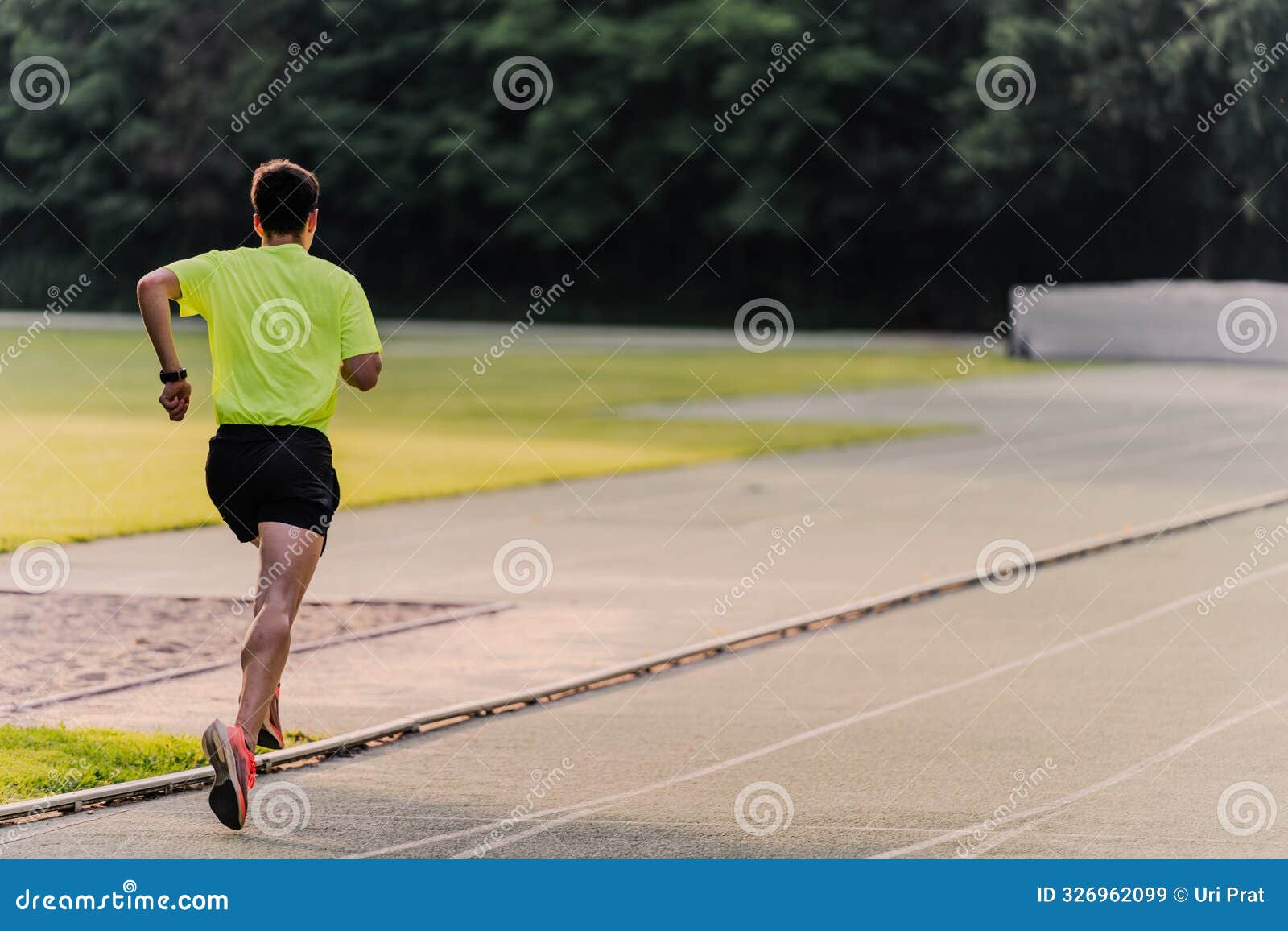 Athlete Making Big Strides while Running on the Athletics Track. Copy ...