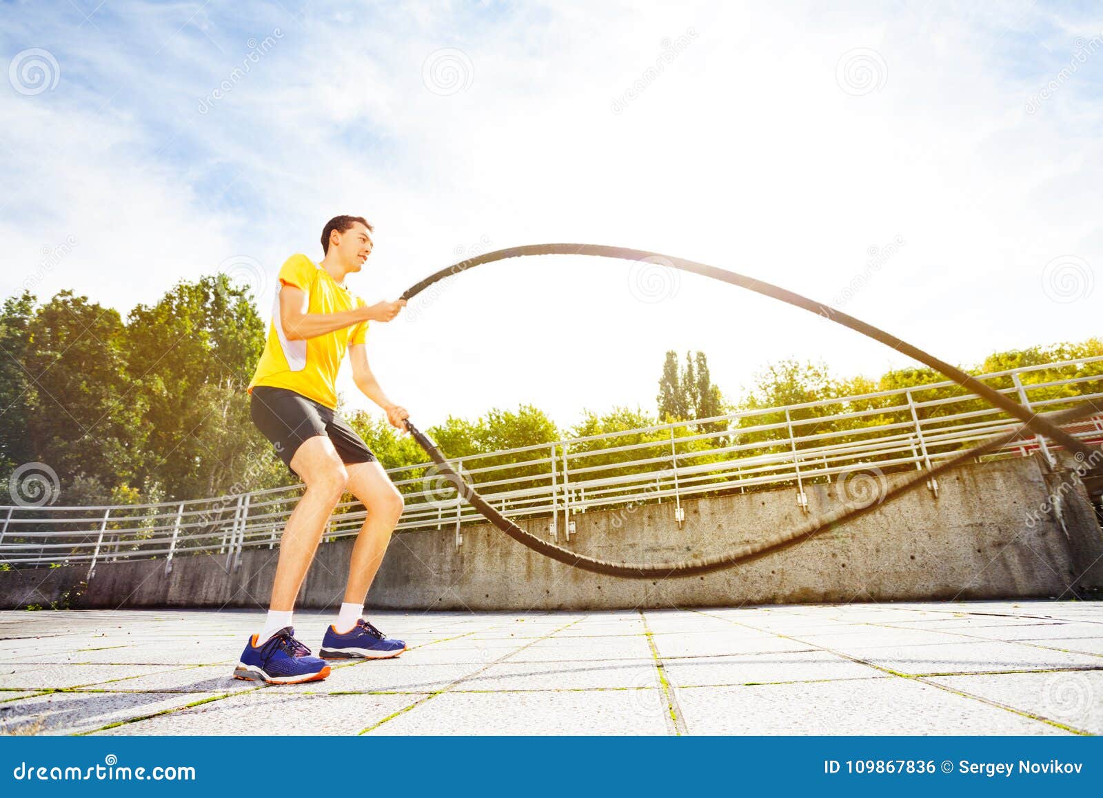 Athlete Making Wave Movement with Muscle Rope Stock Photo - Image of ...