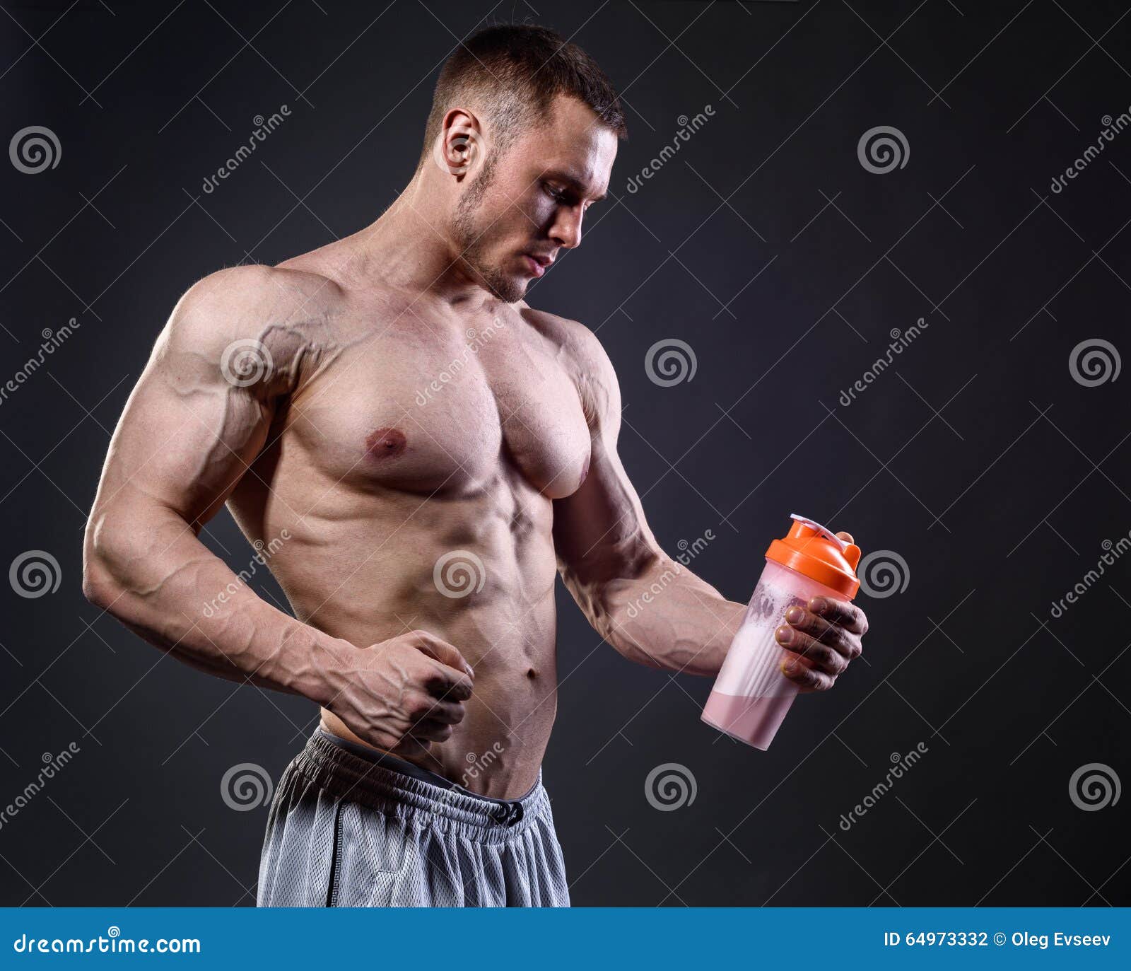Athlete Man Looking at the Protein Shaker Over Stock Photo - Image of ...