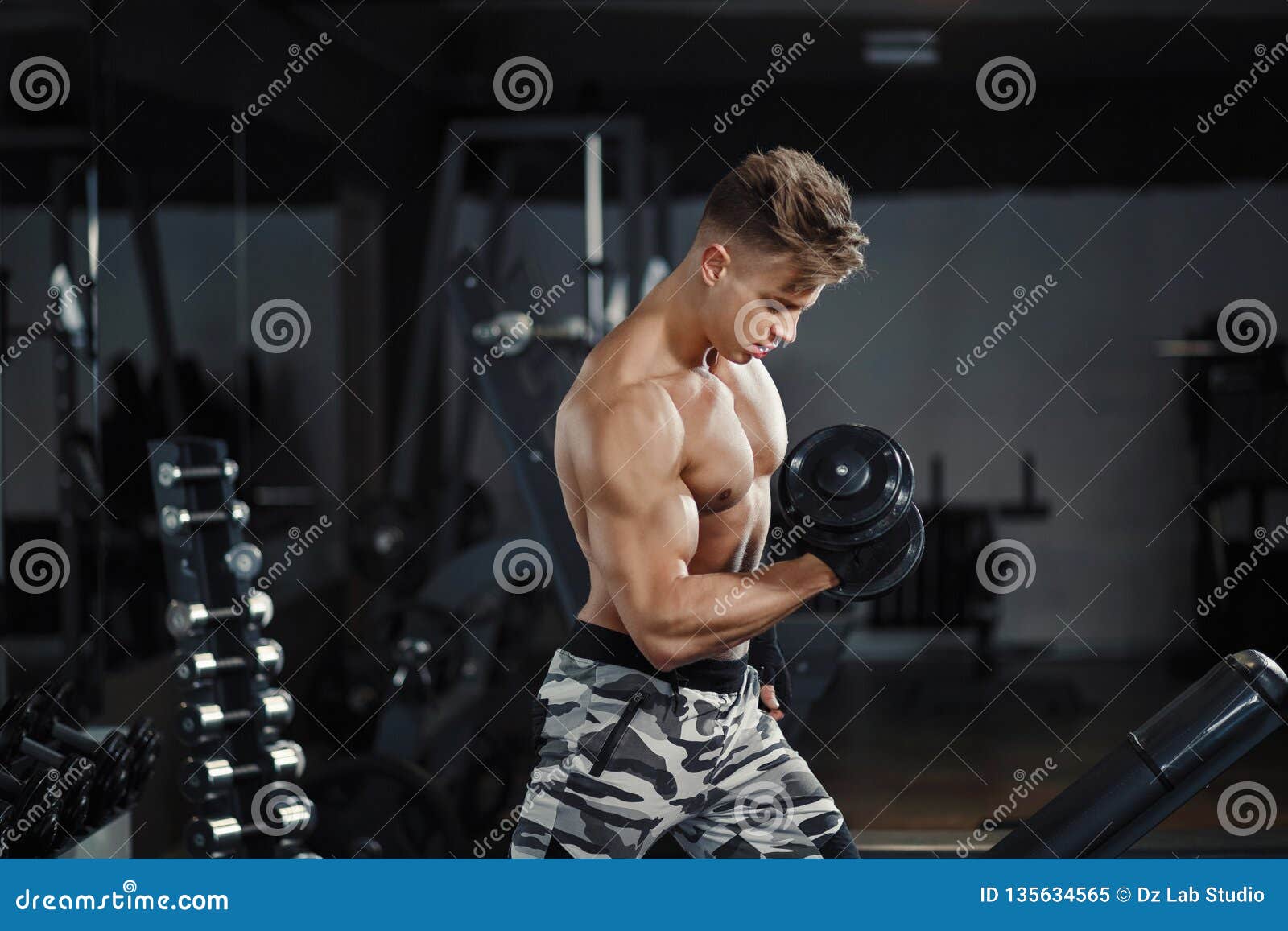 Athlete Muscular Bodybuilder Training Biceps Curl with Dumbbell in the ...