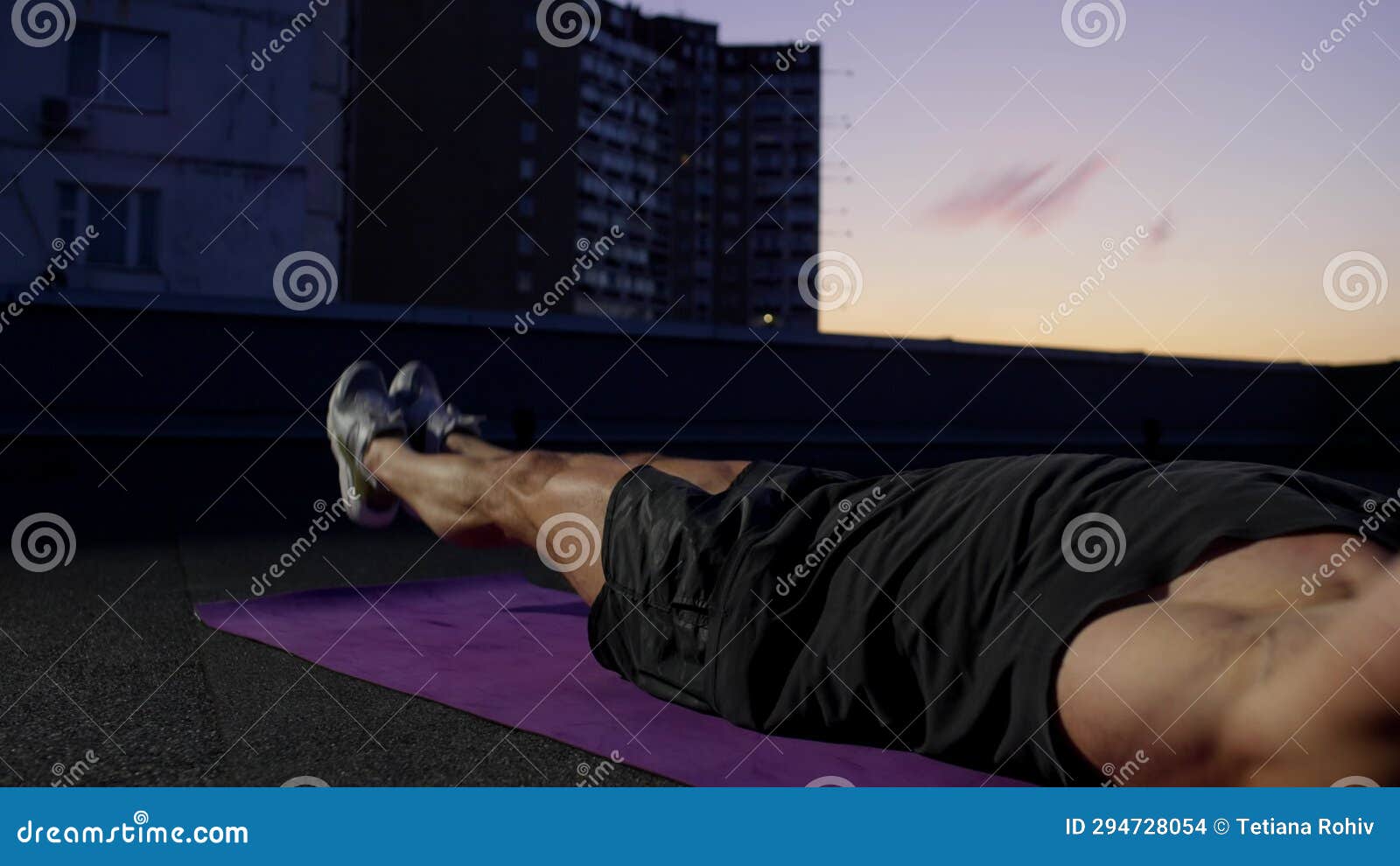 An Athlete Performs an Exercise, a Beam Illuminates the Work of the ...