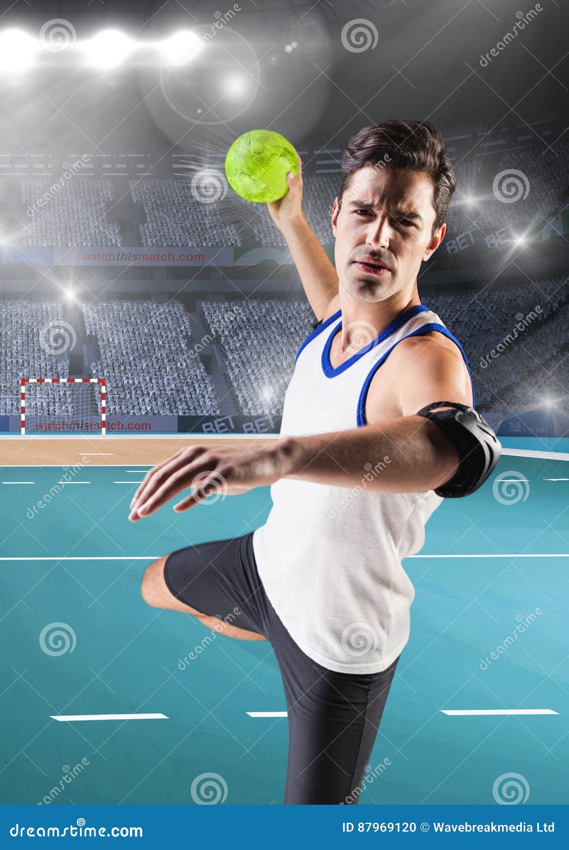 Athlete Playing Handball Against Stadium in Background Stock Photo ...
