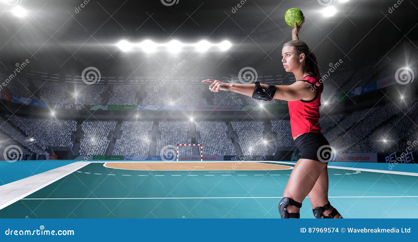 Athlete Playing Handball Against Stadium in Background Stock Photo ...