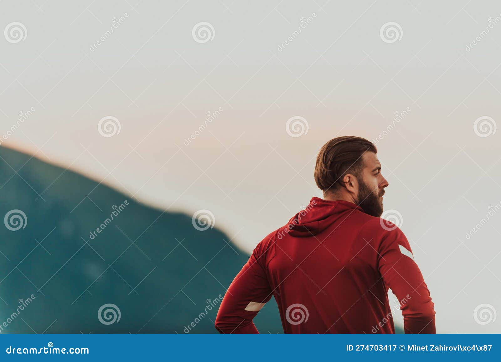 An Athlete Rests on Top of a Mountain after Exhausting Running Training ...