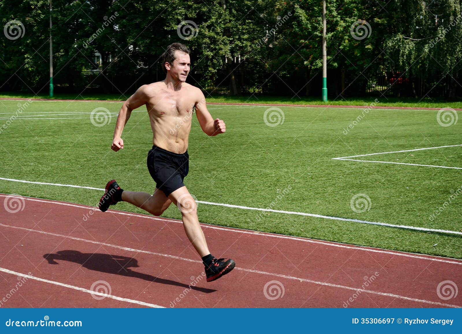 Athlete Runner Trains at the Stadium Stock Image - Image of jogging ...