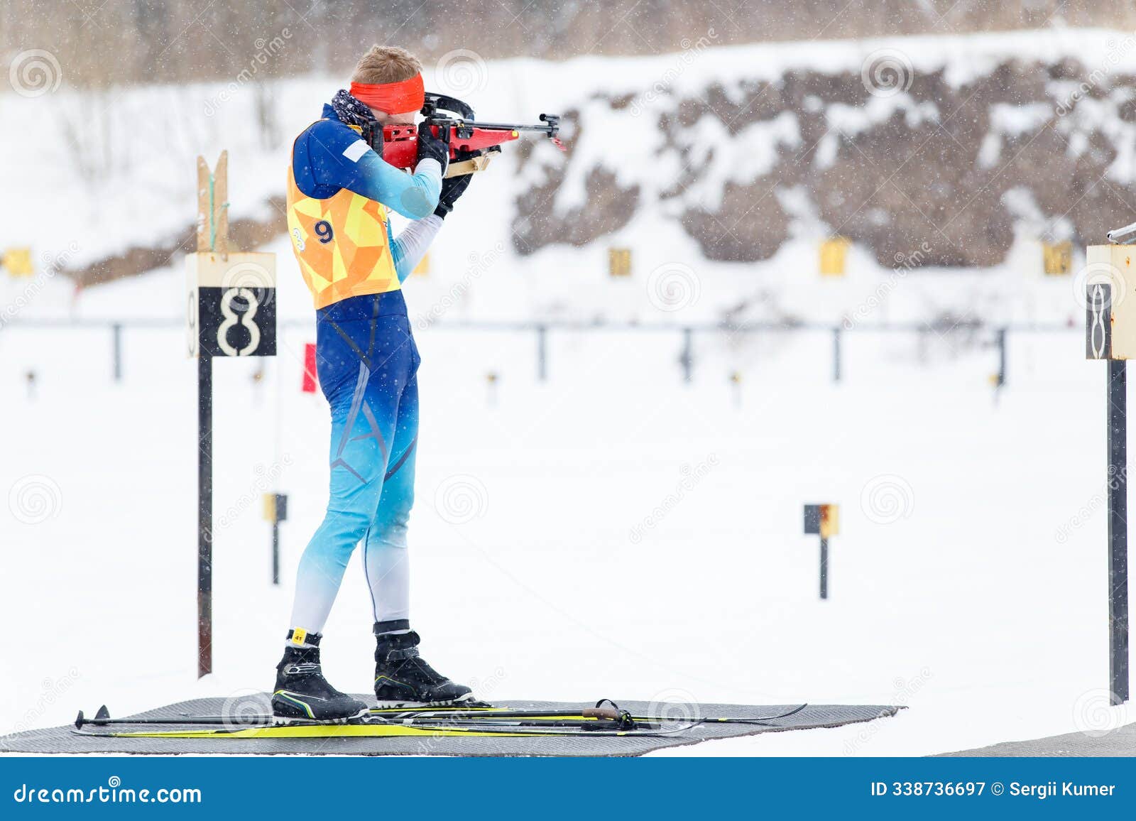 Athlete Shooting in Standing Position at the Range in a Biathlon ...