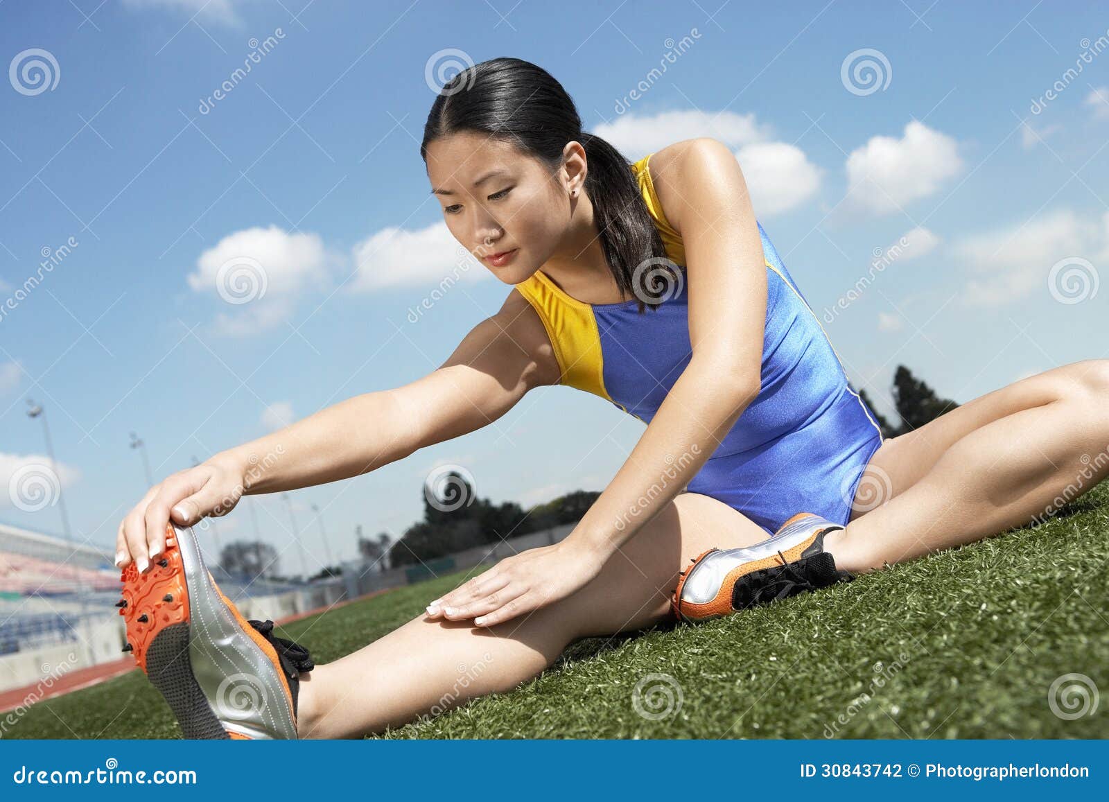 Athlete Stretching on Field Stock Photo - Image of serious, sport: 30843742