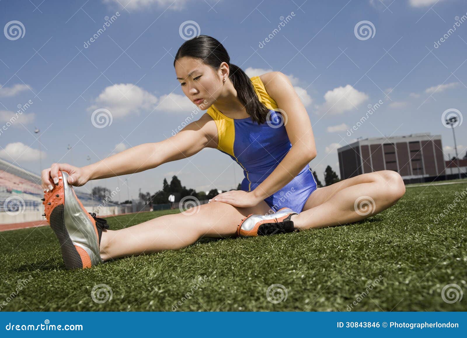 Athlete Stretching on Field Stock Photo - Image of outside, field: 30843846