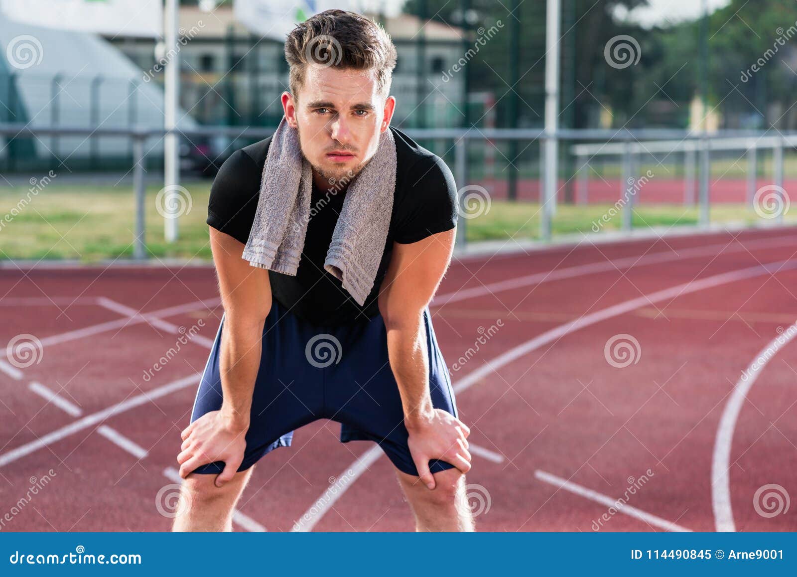 Athlete Stretching on Racing Track before Running Stock Image - Image ...