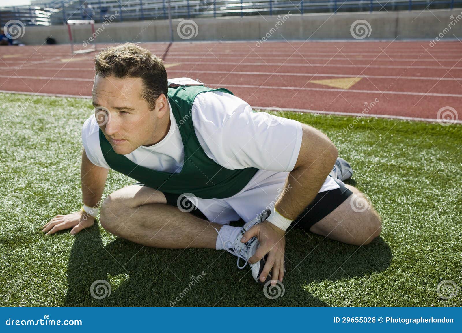 Athlete Stretching on Track Stock Photo - Image of event, sitting: 29655028