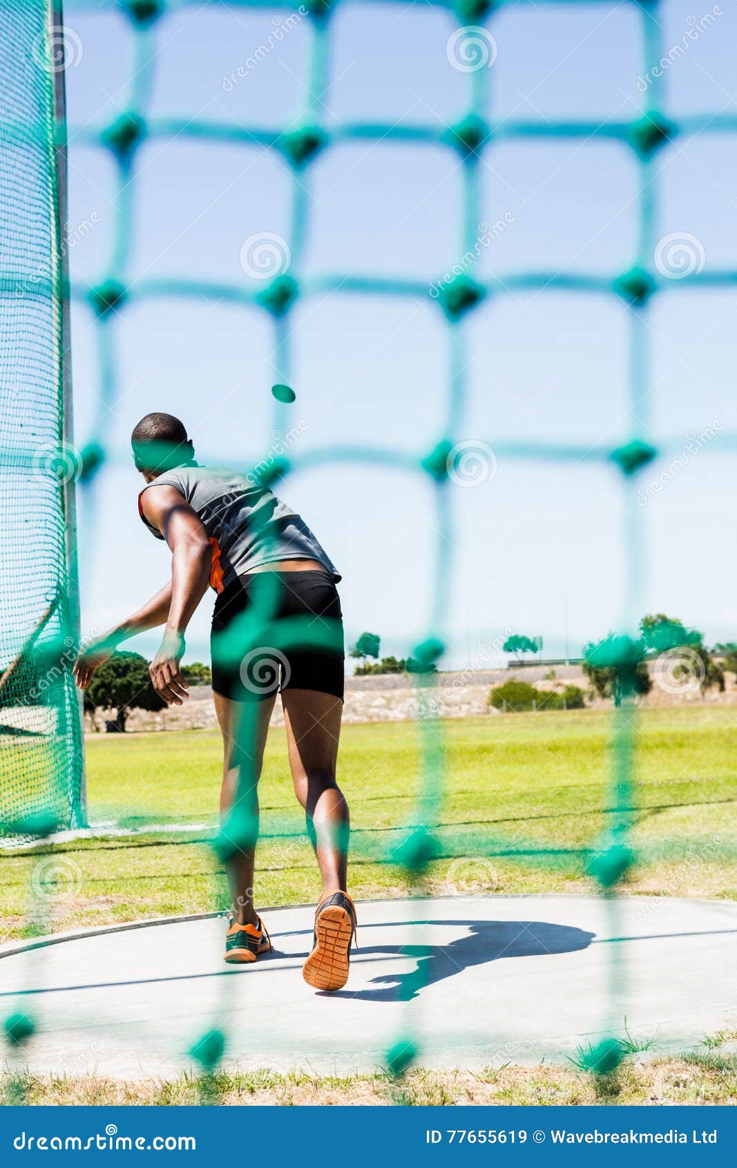 Athlete Throwing Discus in Stadium Stock Image - Image of discus, male ...