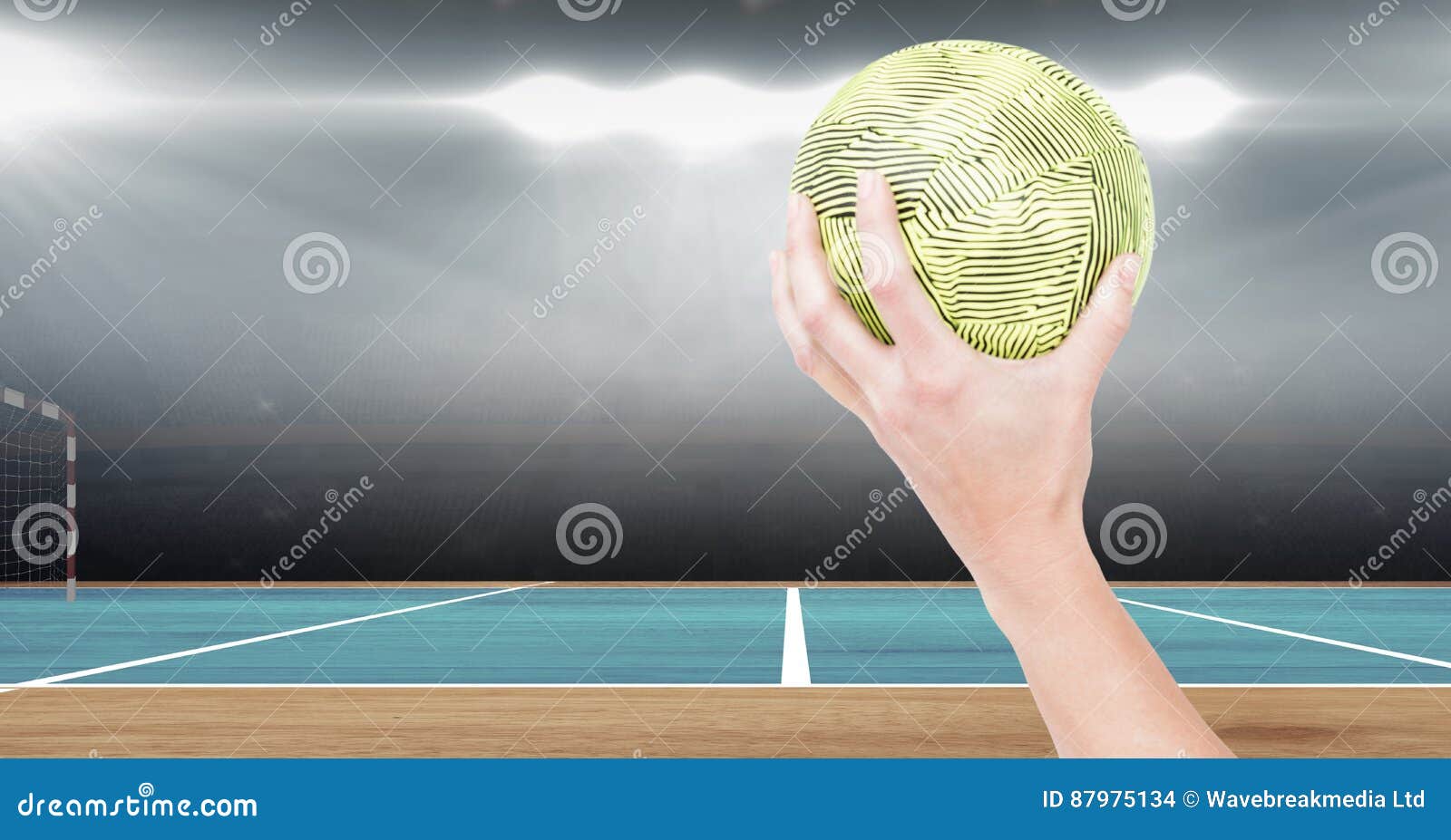 Athlete Throwing Handball Against Stadium In Background Stock Photo ...