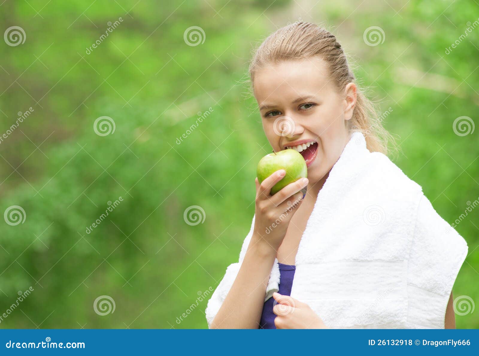 Athlete woman eating apple stock photo. Image of body - 26132918