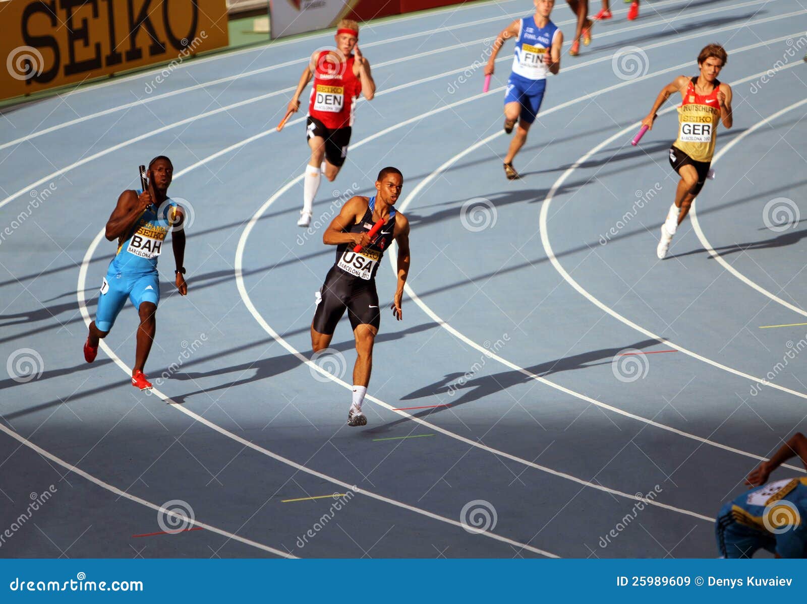 Athletes on the 4 X 100 Meters Relay Race Editorial Stock Image - Image ...