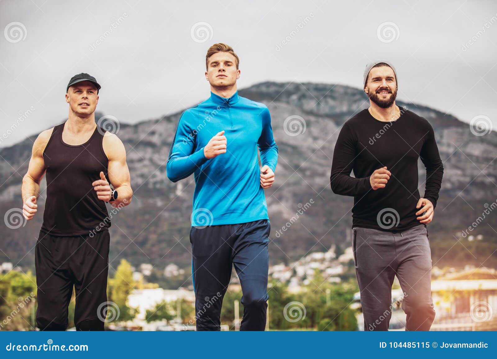 Athletes Practicing a Run on Athletics Stadium Track. Stock Image ...