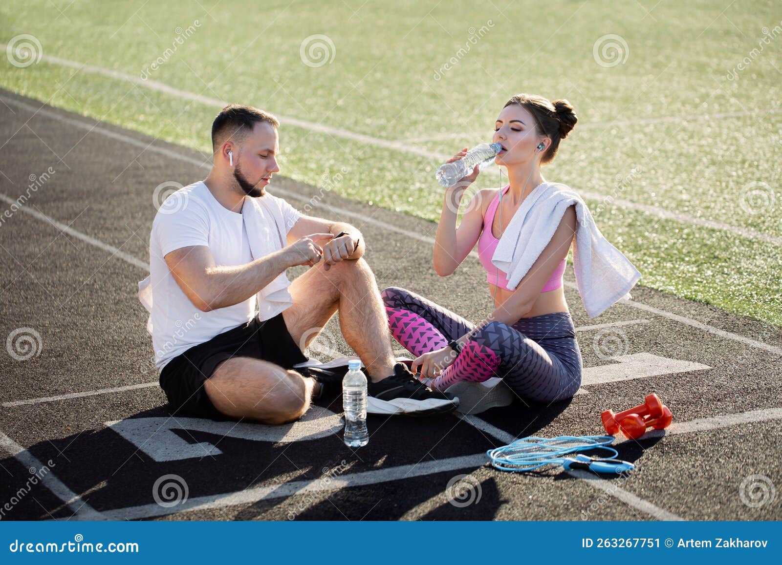 Athletes Rest after an Active Training Session at the Stadium. Stock ...