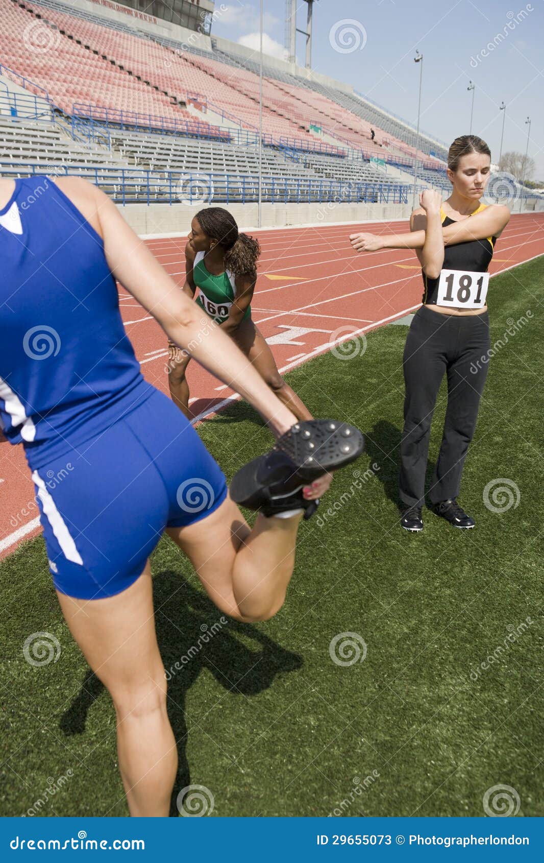 Athletes Stretching on Track and Field Stock Image - Image of middle ...