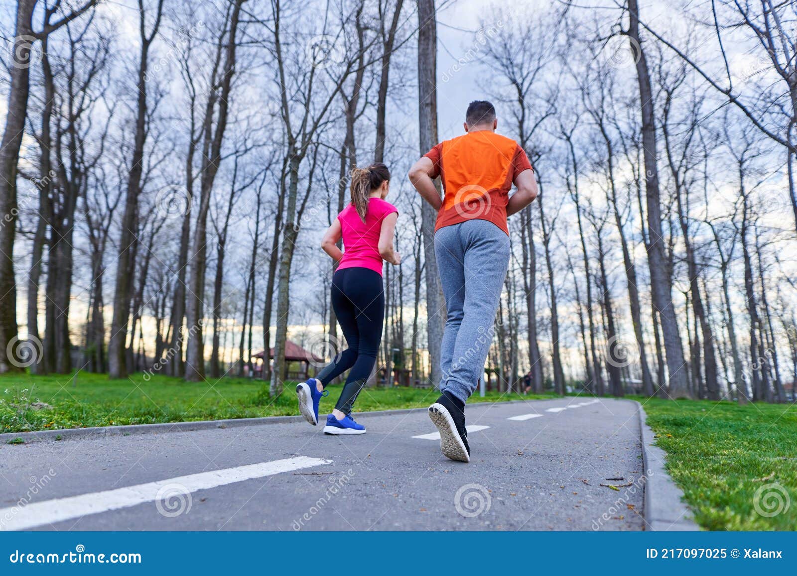 Young Couple Running in the Park Stock Image - Image of adult, body ...