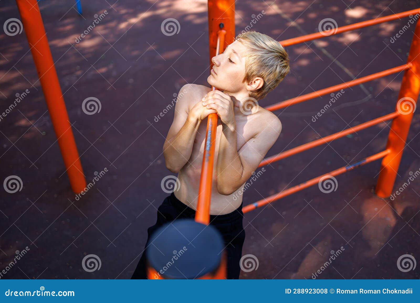 Street Workout on a Horizontal Bar in the School Park Stock Photo ...