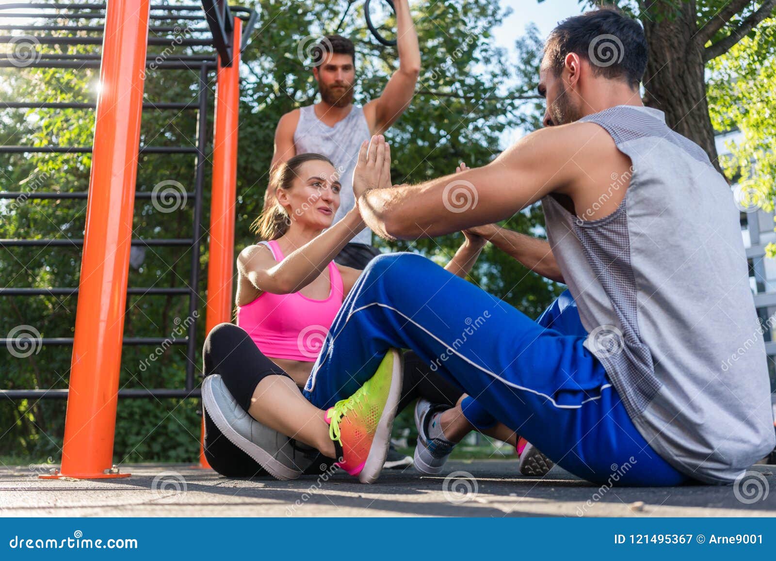 Athletic Couple Clapping Hands while Doing Crunches Face To Face Stock ...