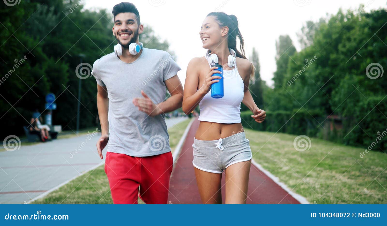 Athletic Couple Jogging Together Stock Photo - Image of bridge, athlete ...