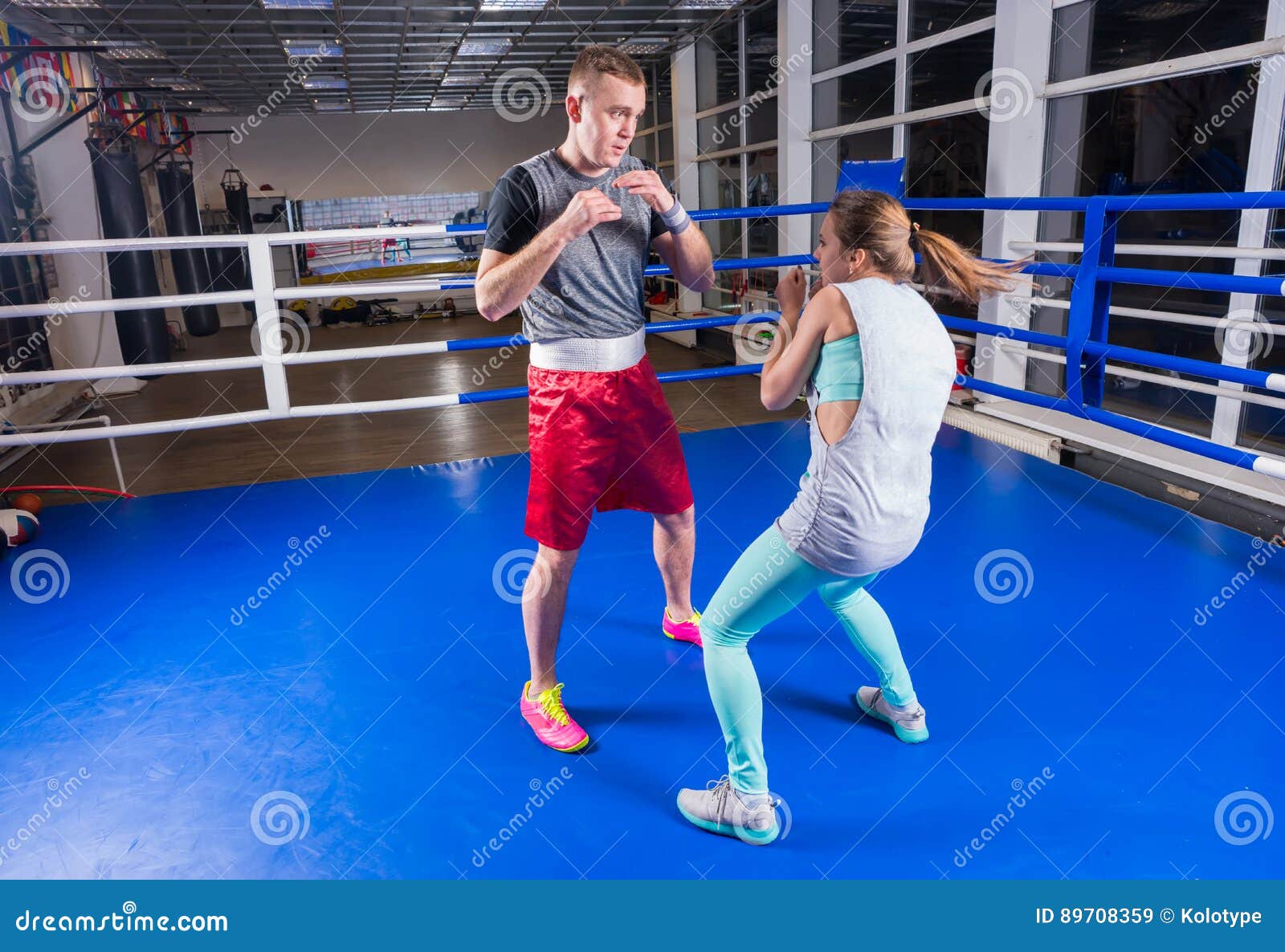 Athletic Couple in Sportswear Practicing Boxing in Regular Boxing Ring ...