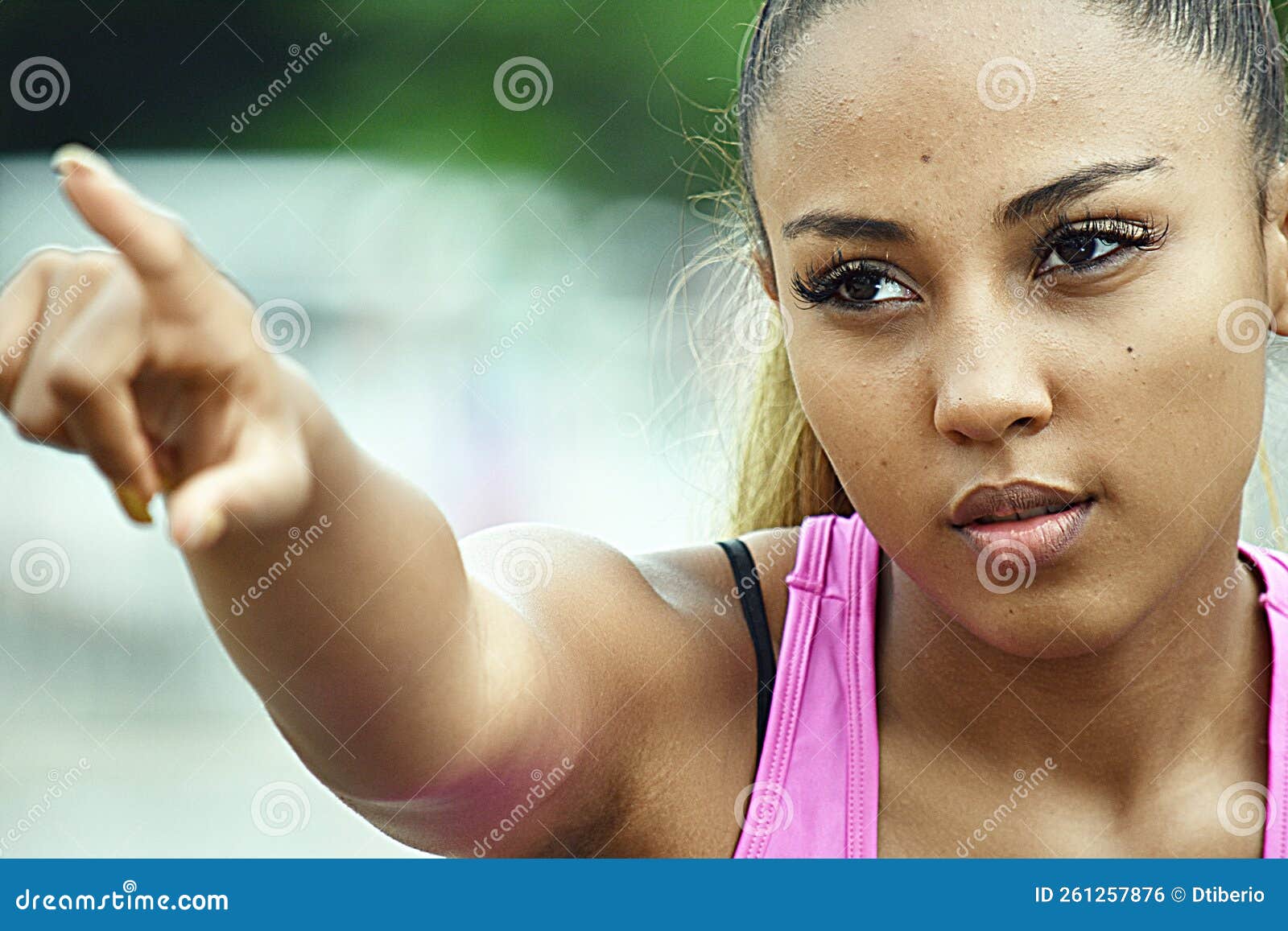 An Athletic Female Pointing Stock Photo - Image of sports, guidance ...
