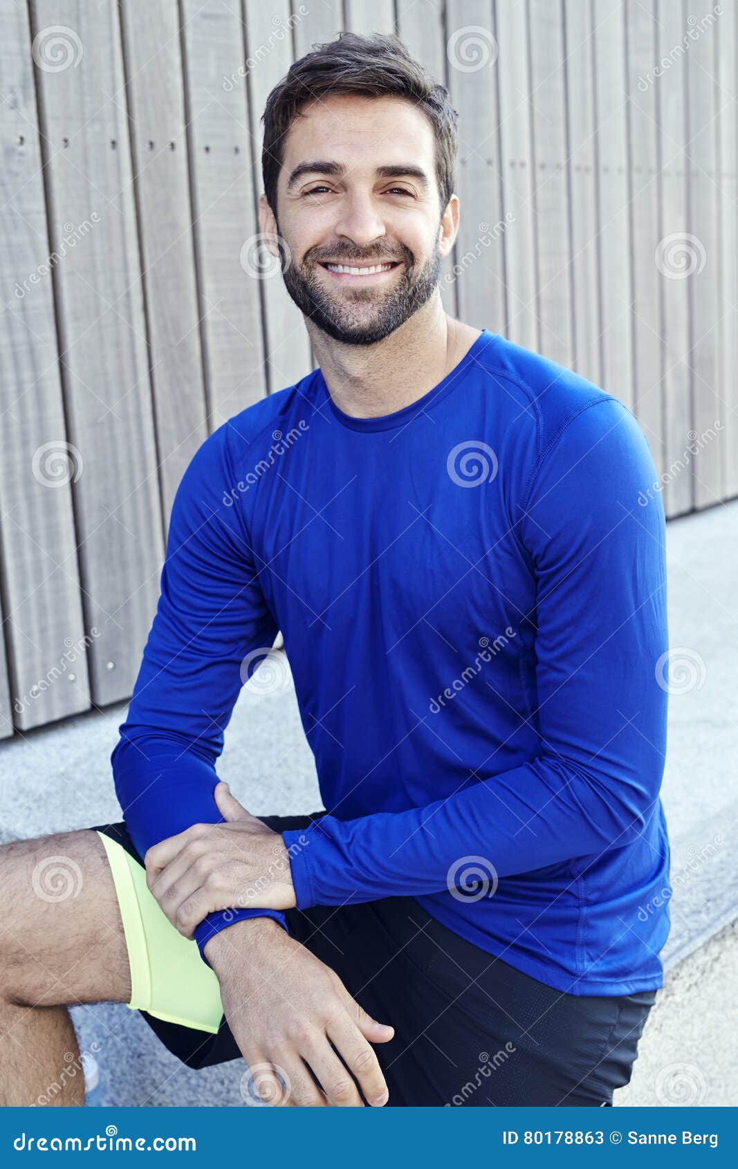 Athletic Guy in Blue Smiling Stock Image - Image of cheerful, blue ...