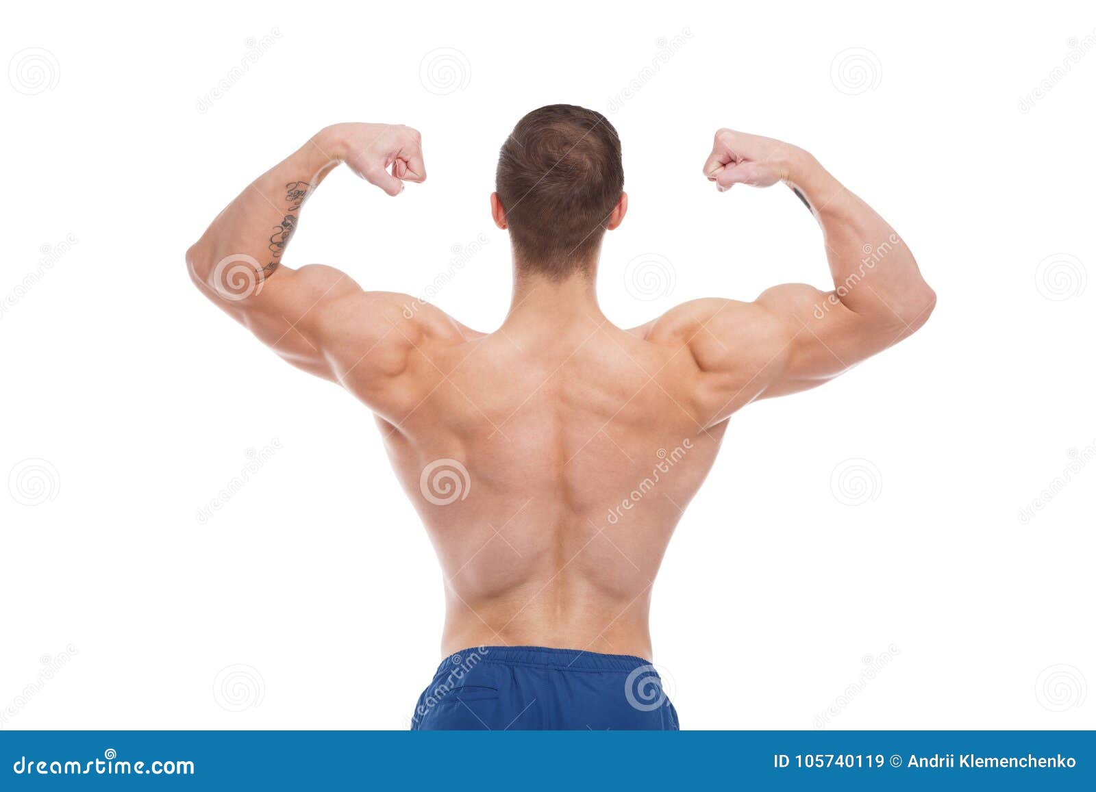 The Athletic Guy, Stands with His Back and Shows the Muscles of the ...