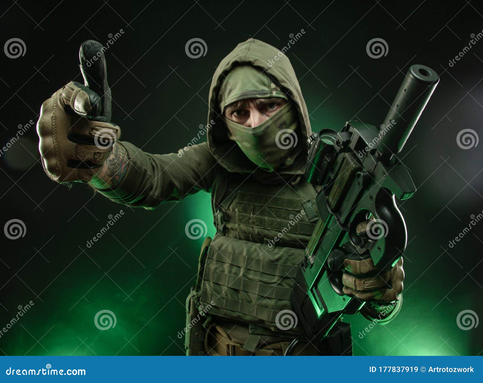 An Athletic Guy with a Tattoo Poses with a Automatic Rifle Stock Image ...