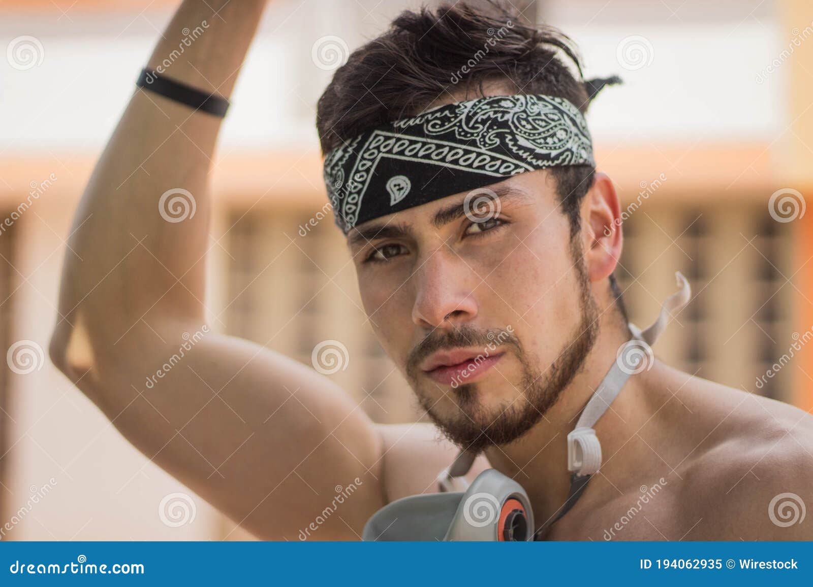 Athletic Male with a Face Mask Working Out on a Field during the Day ...