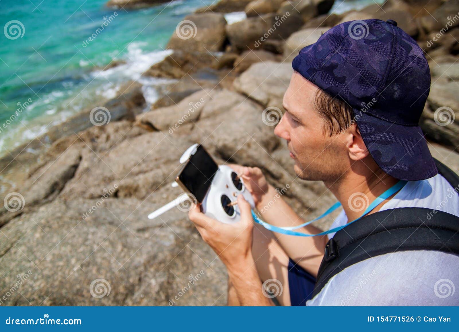 Man Operating a Drone with Remote Control on Beach. Stock Photo - Image ...
