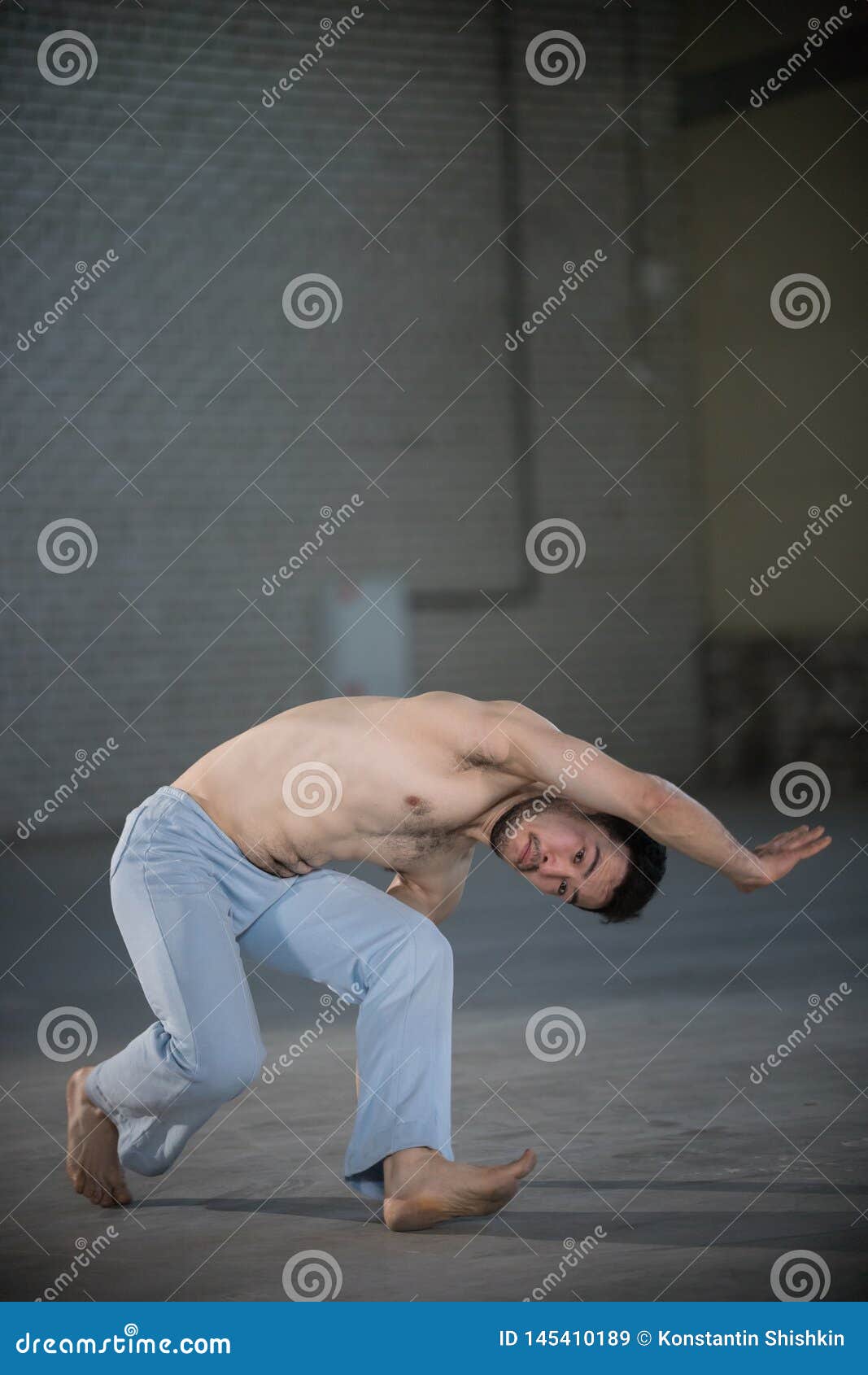 An Athletic Man on Capoeira Training. Standing in the Pose Stock Image ...