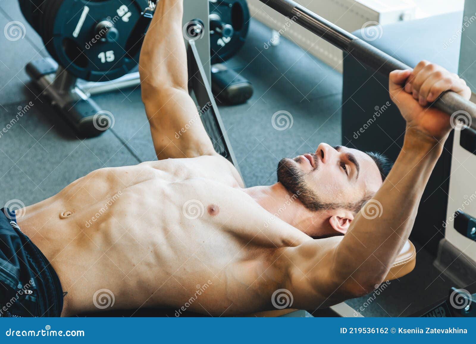 Athletic Man Doing Barbell Exercise. Professional Bodybuilder Doing ...