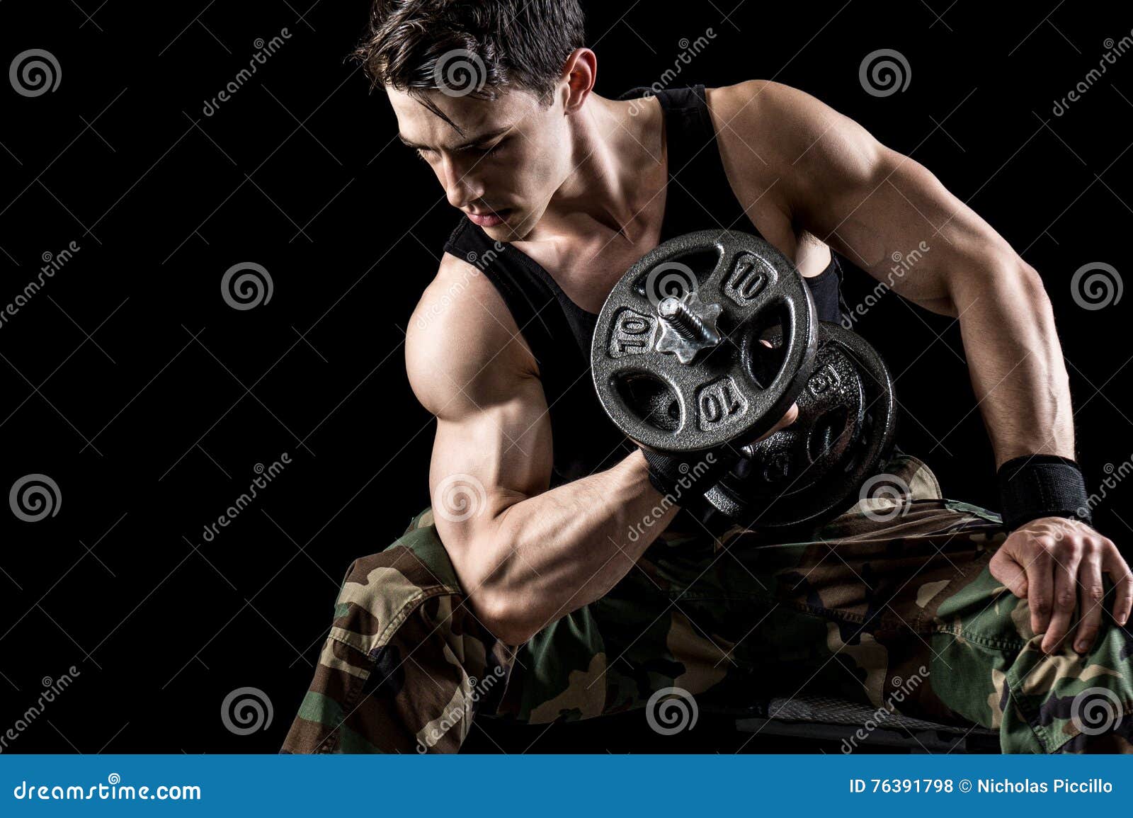 Athletic Man Exercising stock photo. Image of shot, training - 76391798