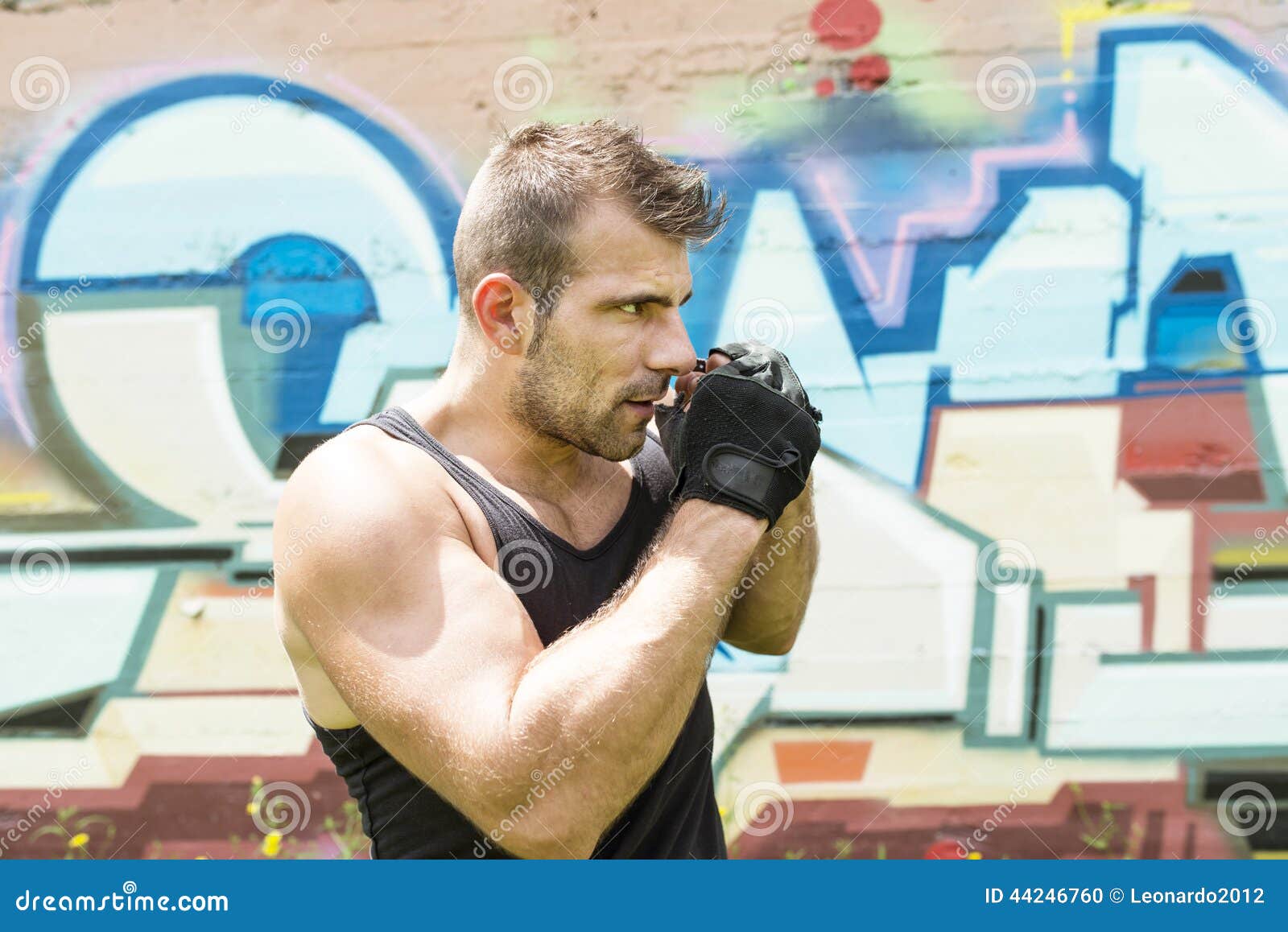 Athletic Man Fighter in Boxing Pose, Urban Style. Stock Photo - Image ...
