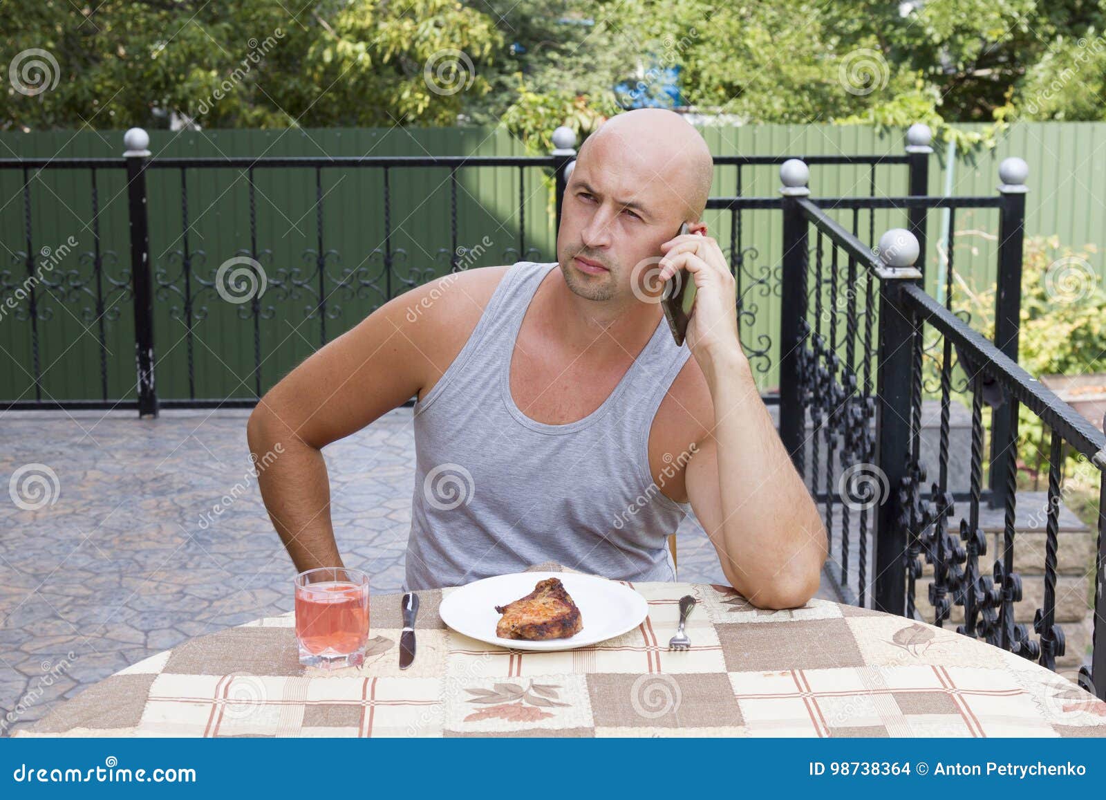 Man Talking on the Phone while Eating Stock Photo - Image of pepper ...