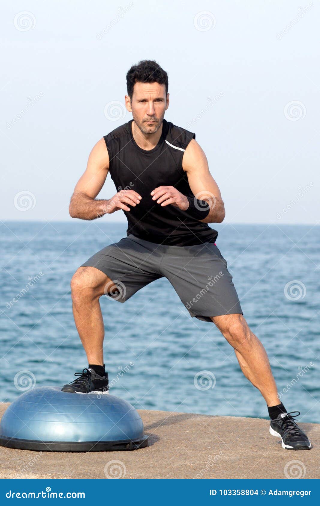 Athletic Man Making a Step Exercise on Balance Platform Stock Photo ...