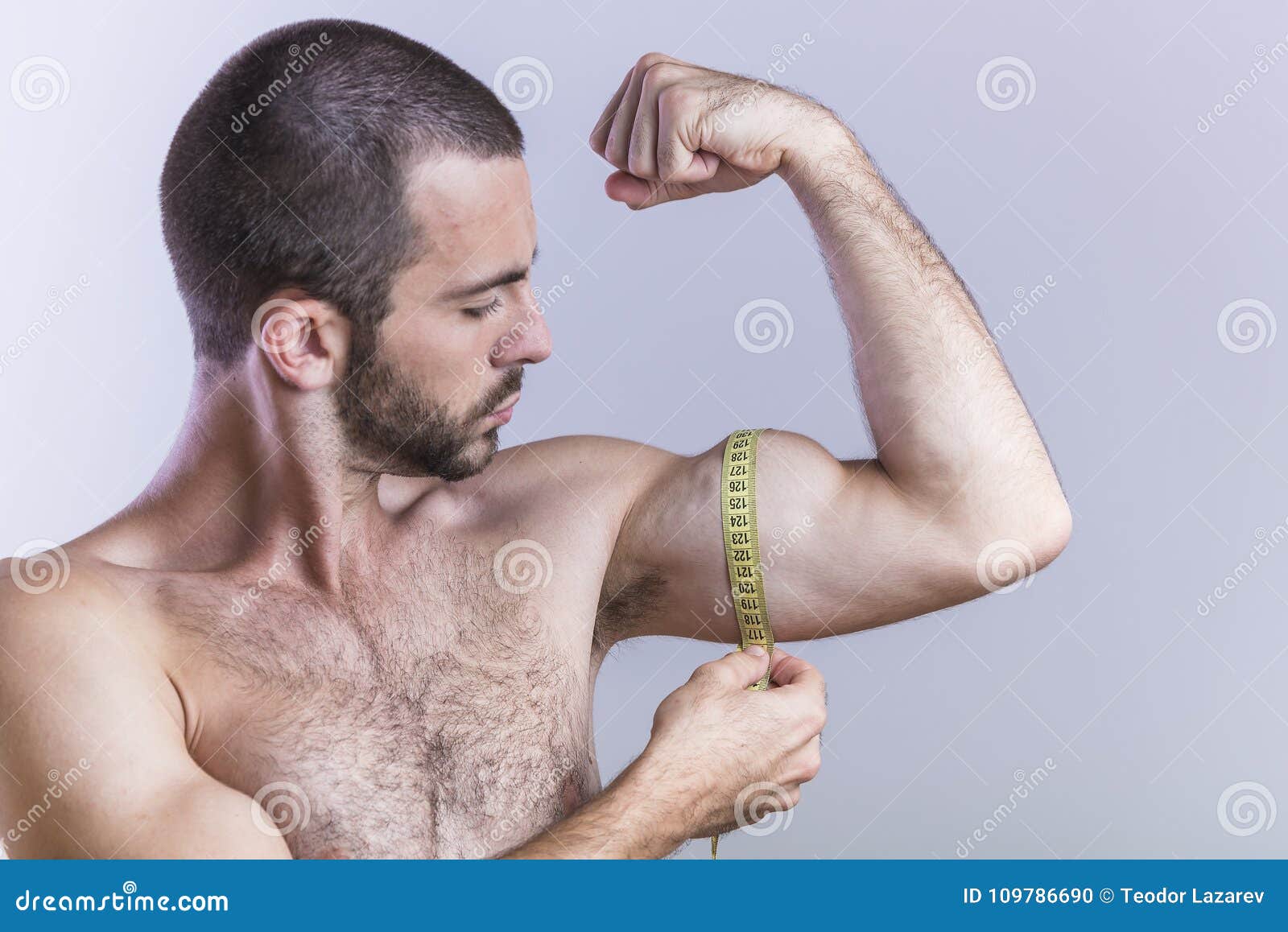 Athletic Man Measuring His Biceps Size Stock Photo - Image of muscular ...