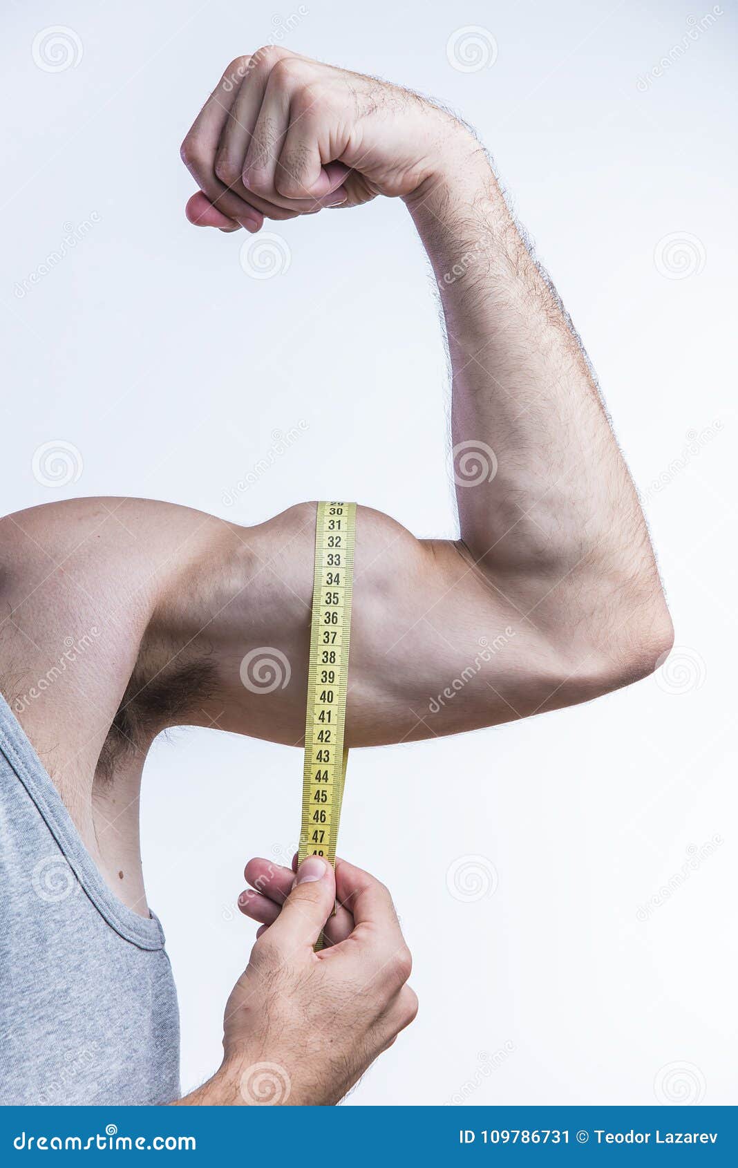Athletic Man Measuring His Biceps Size Stock Image - Image of measuring ...