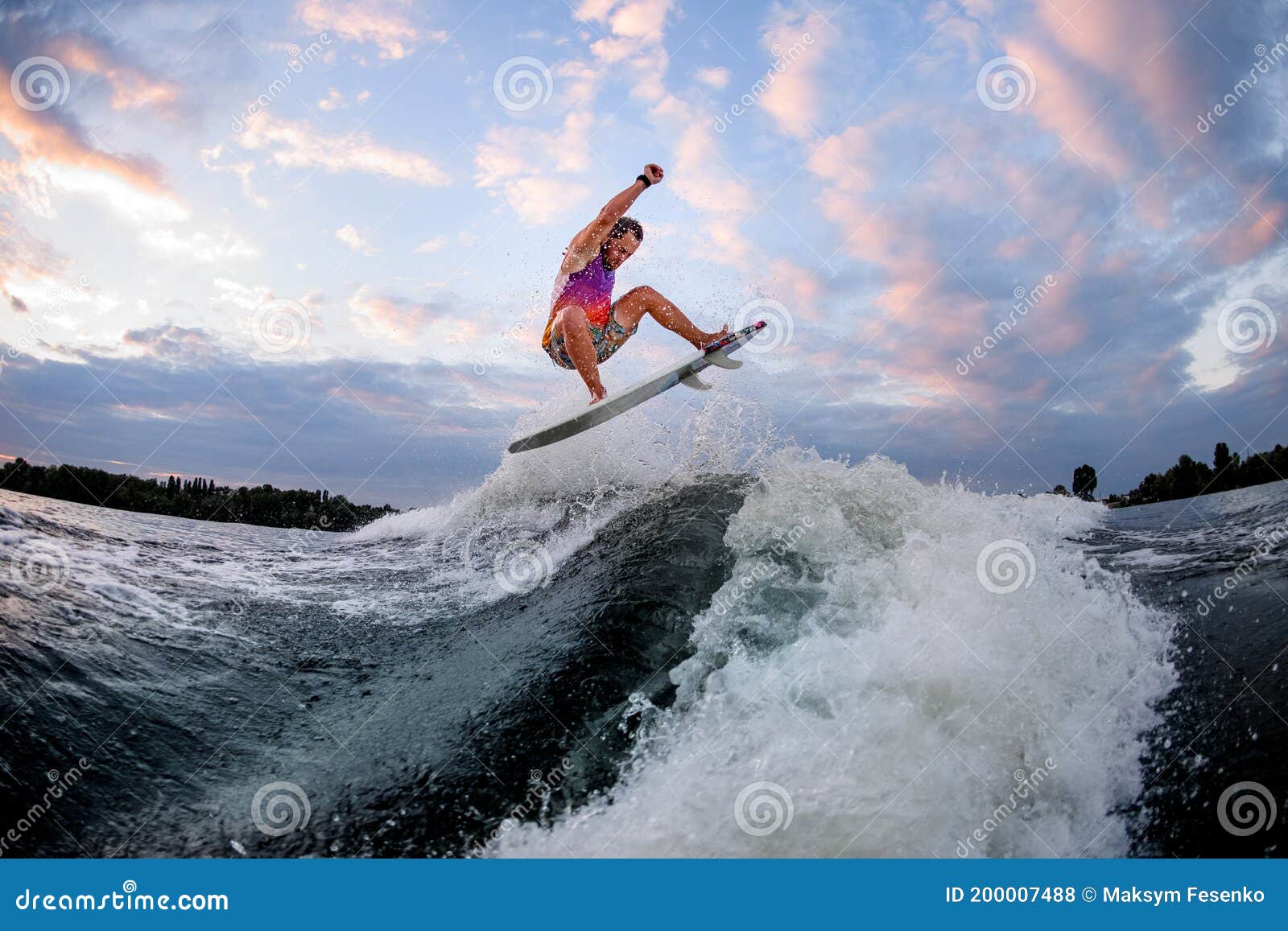 Athletic Man Riding Large Wave Doing Jumps and Tricks on the Surf Style ...