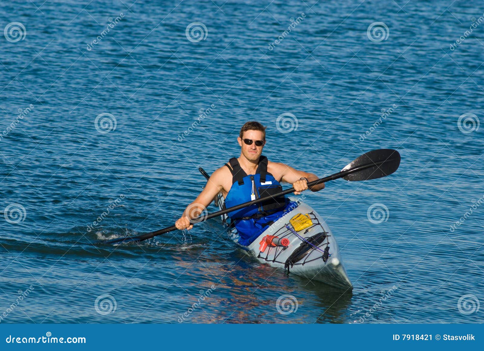Athletic man in sea kayak stock image. Image of nautical - 7918421