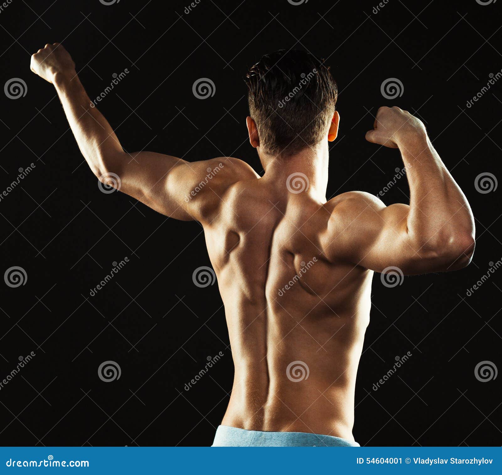 Athletic Man Showing His Back On The Black Background Stock Image ...