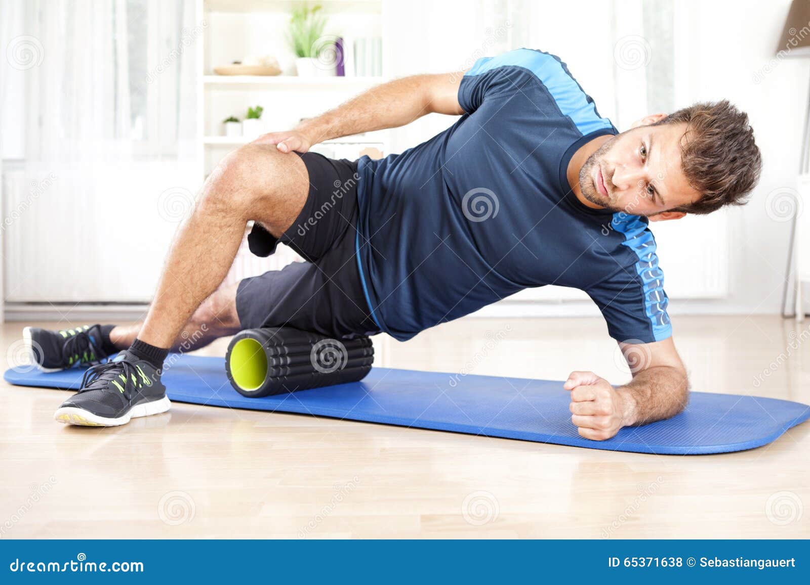 Athletic Man in Side Planking Using Foam Roller Stock Photo - Image of ...