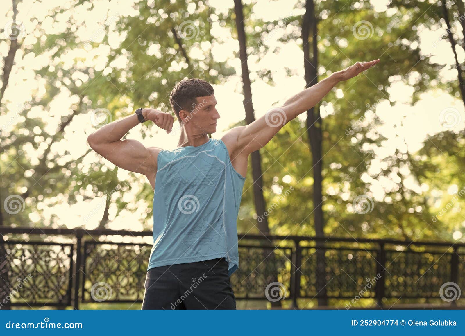 Athletic Man Standing in Bodybuilder Pose. Sport Training Stock Photo ...