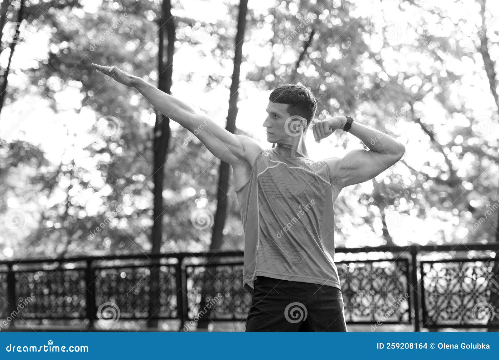 Athletic Man Standing in Bodybuilder Pose. Sport Training Stock Photo ...