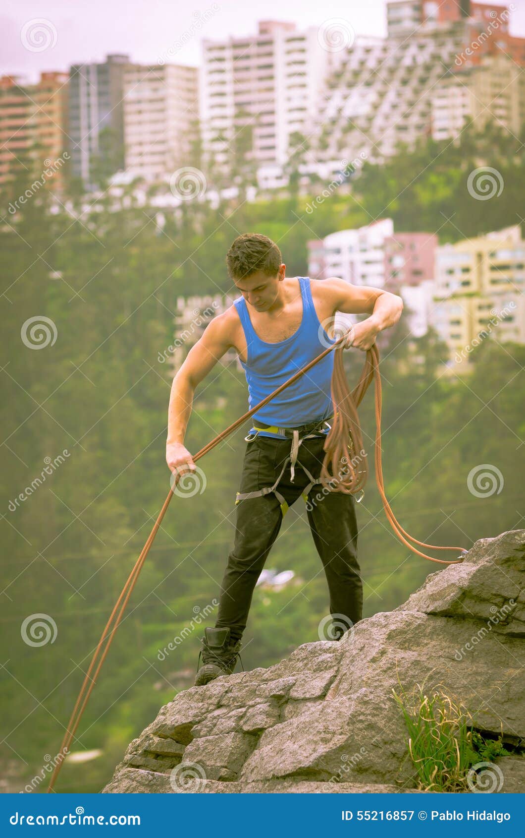 Athletic Man Standing on Cliff with Rope in Hands Stock Image - Image ...
